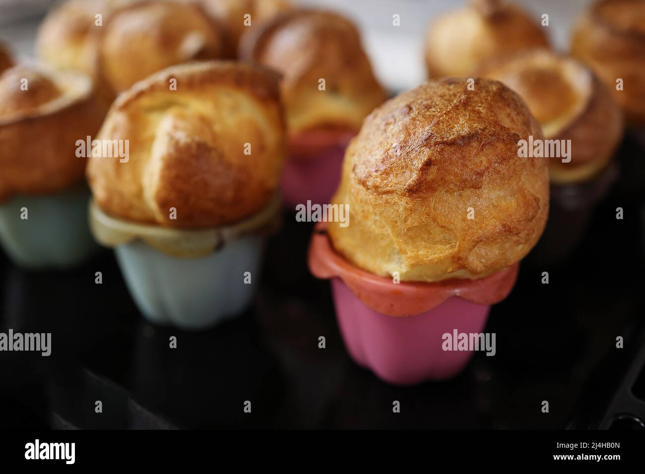 Homemade popover, which is a lush, airy and egg hollow roll, fresh from ...