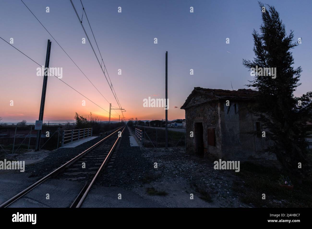 Perspective view of a railroad at dusk Stock Photo - Alamy