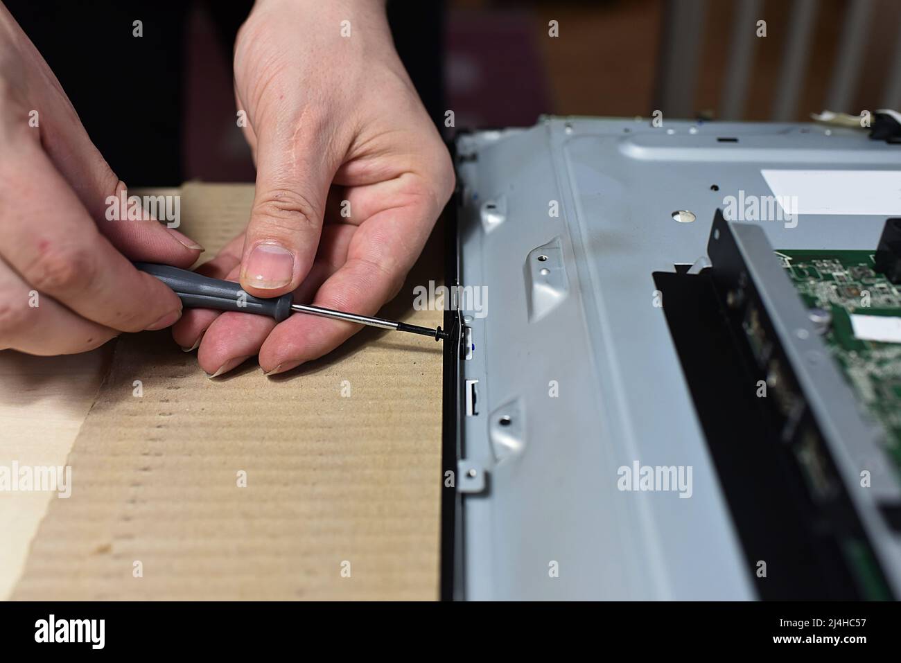The man repairing broken tv Stock Photo - Alamy