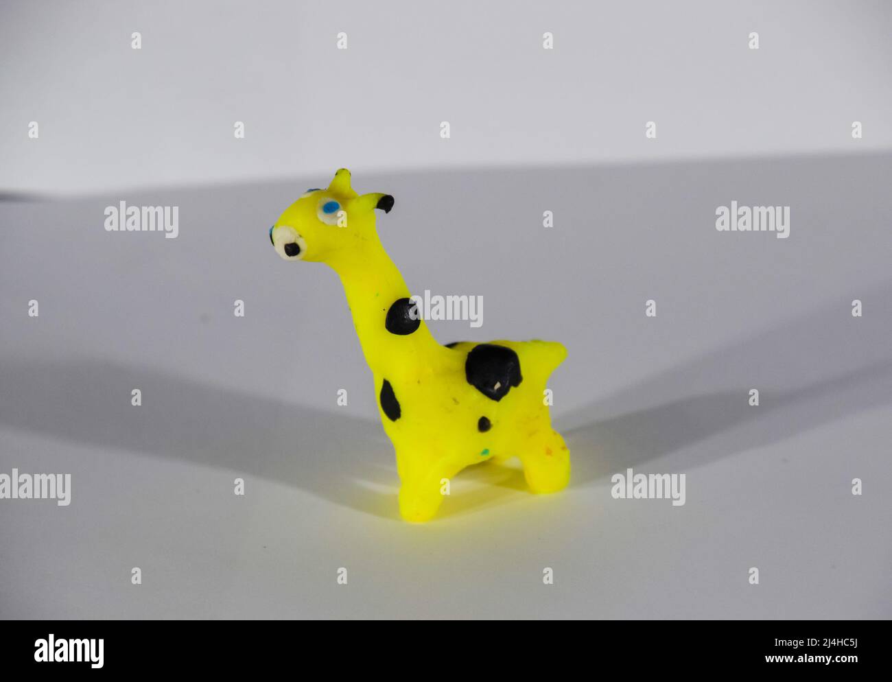 Plasticine giraffe. Plasticine toys on a white background Stock Photo ...