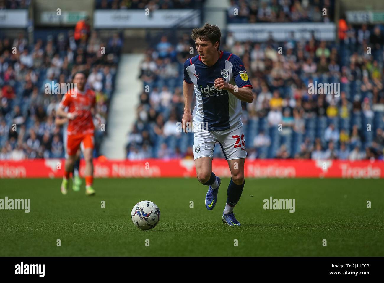 Adam Reach #20 of West Bromwich Albion runs at the Blackpool defence ...