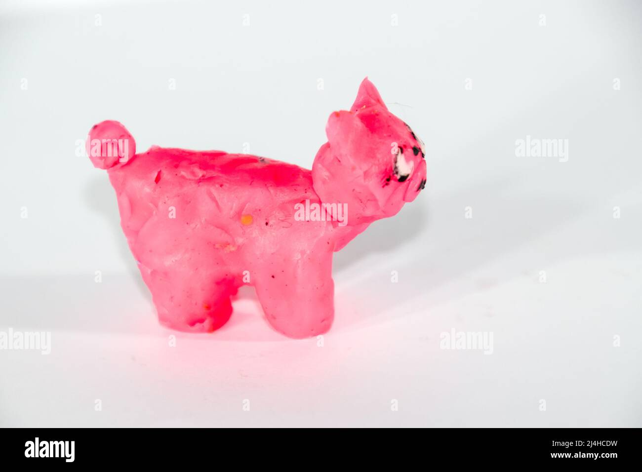 Plasticine piglet. Toys made of plasticine on a white background Stock ...