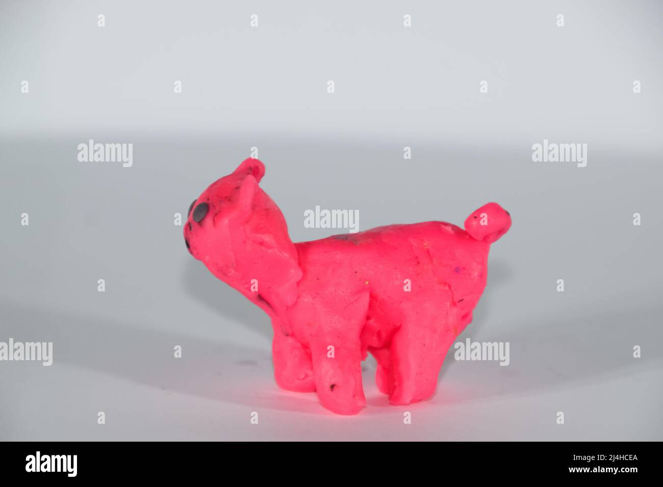 Plasticine piglet. Toys made of plasticine on a white background Stock ...