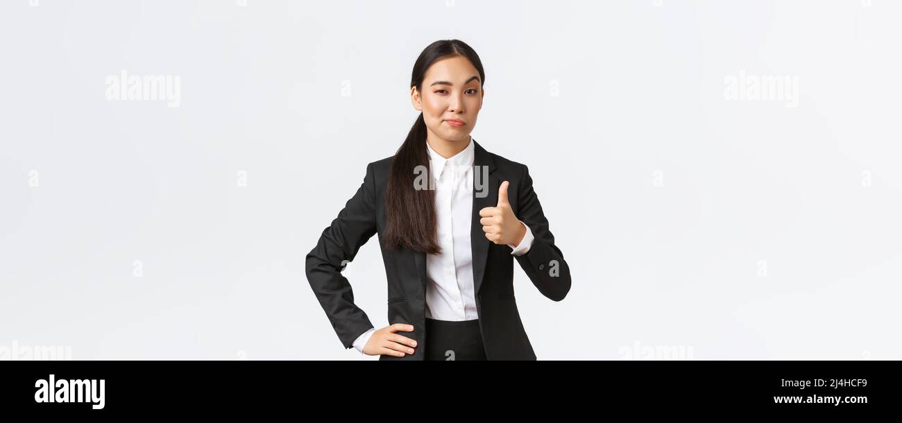 Pleased female entrepreneur, lady boss in black suit satisfied with ...
