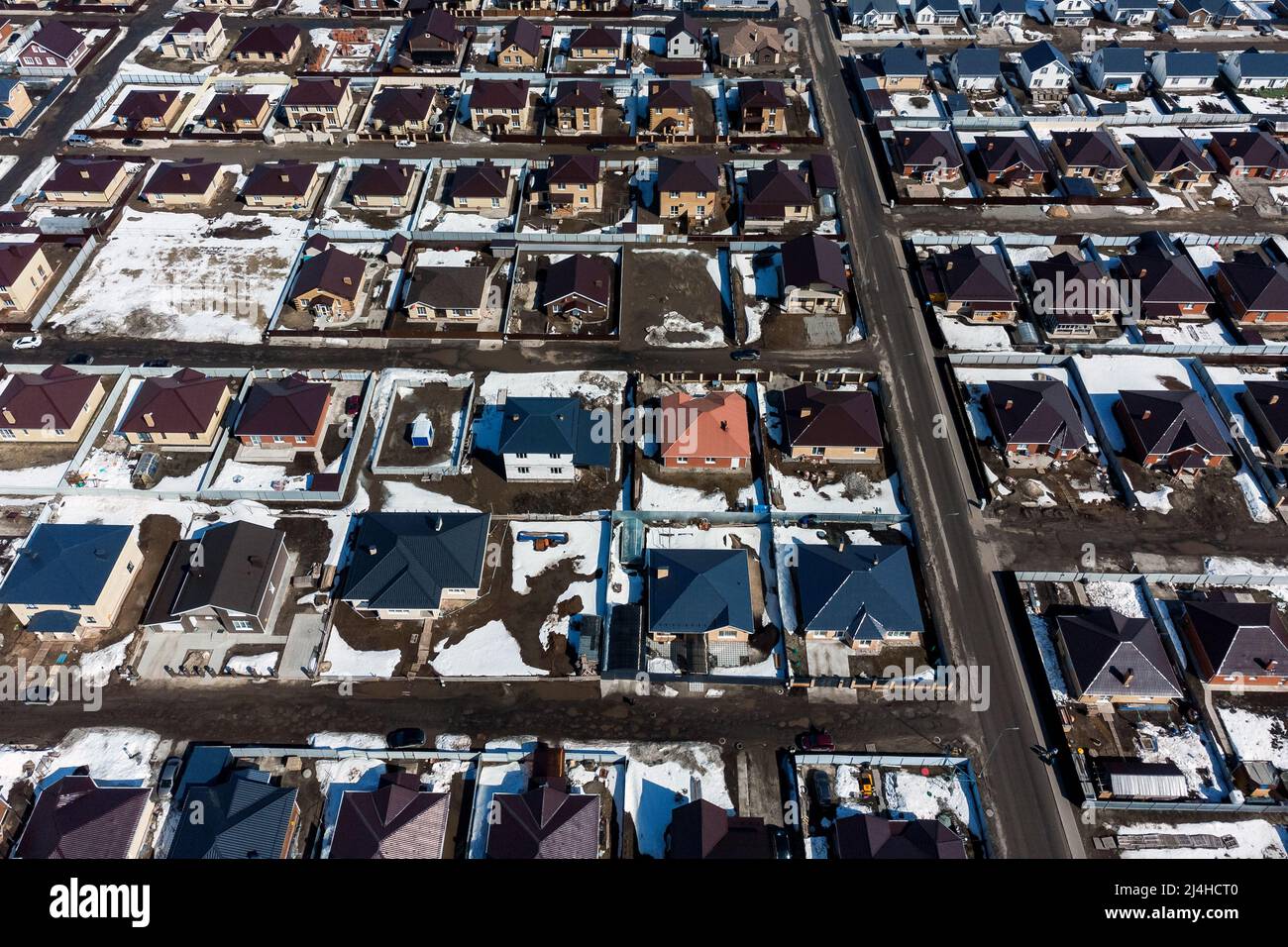 Aerial view of residential suburban village with many single family ...