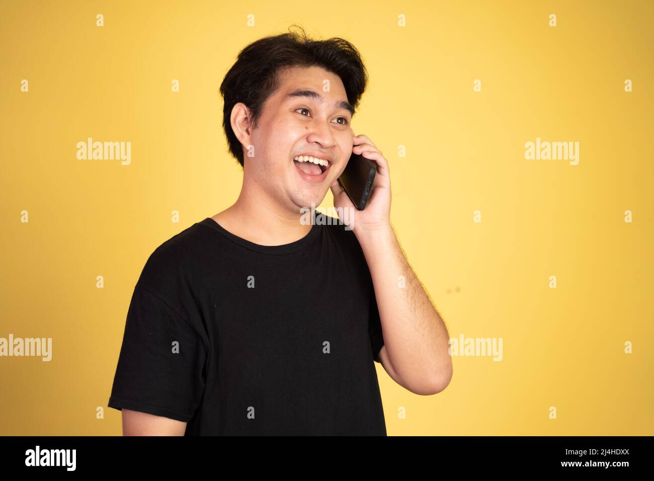 man laughing while making phone call on isolated background Stock Photo ...
