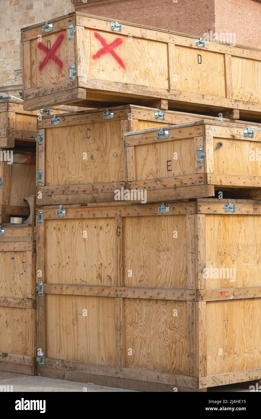 foreground in vertical view of some large wooden boxes stacked for ...