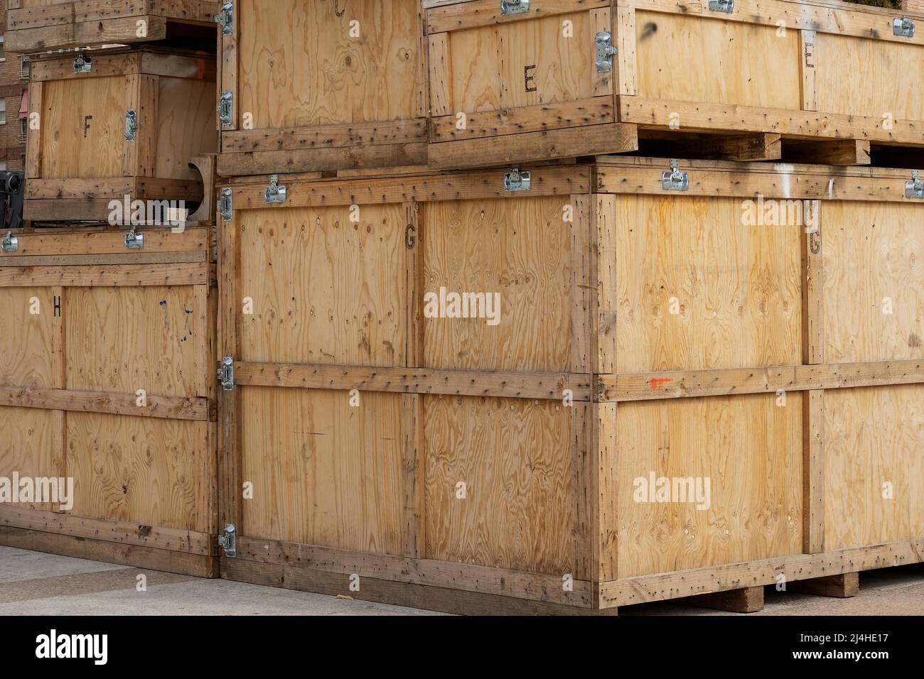 foreground in horizontal view of some large wooden boxes stacked for ...