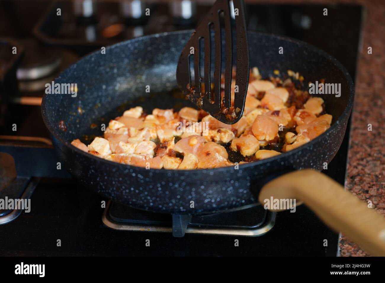 Woman frying bacon hi-res stock photography and images - Alamy