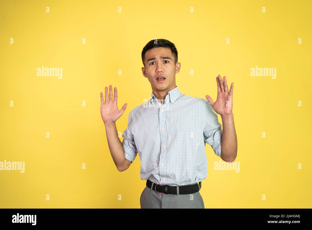 asian young young man with scared gesture on isolated Stock Photo - Alamy