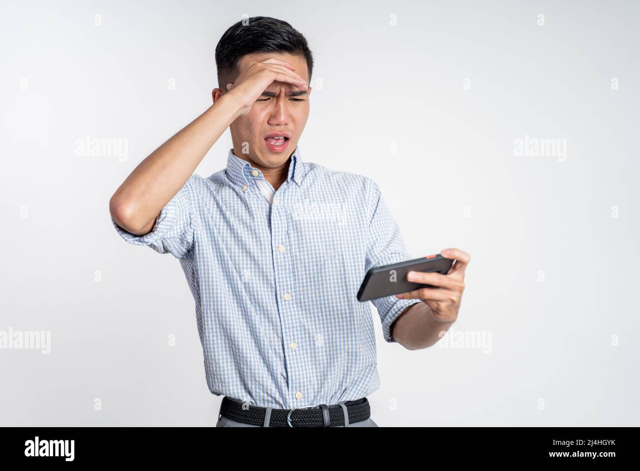 asian man playing video game on his smartphone Stock Photo - Alamy