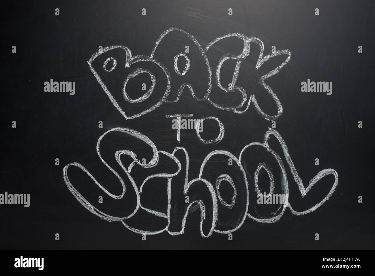 Back to school, the inscription with white chalk on a black school ...