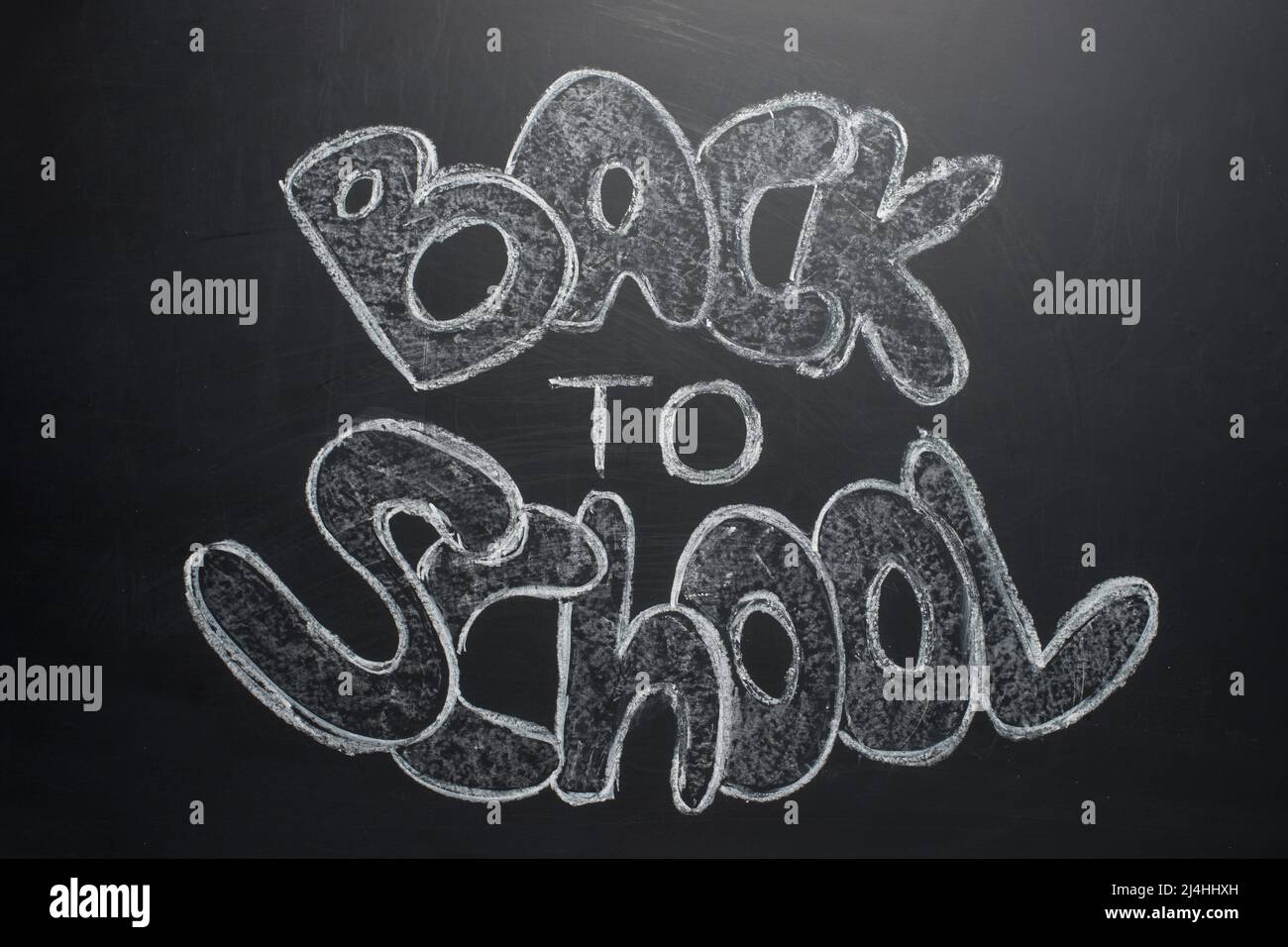 Back to school, the inscription with white chalk on a black school ...