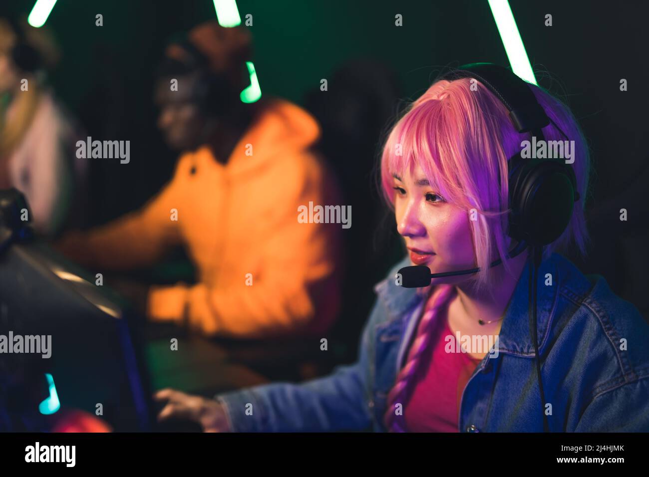 pink-haired girl playing video games and streaming eSport tournament ...