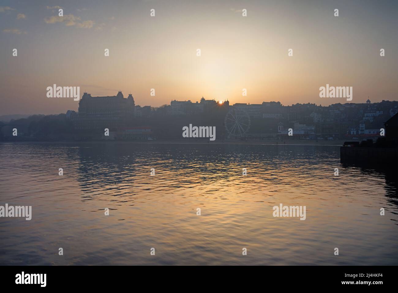 UK, North Yorkshire, Scarborough, Sunset over South Bay and Seafront ...