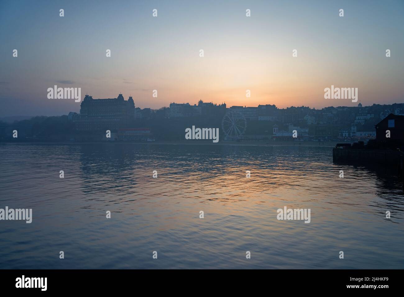UK, North Yorkshire, Scarborough, Sunset over South Bay and Seafront ...