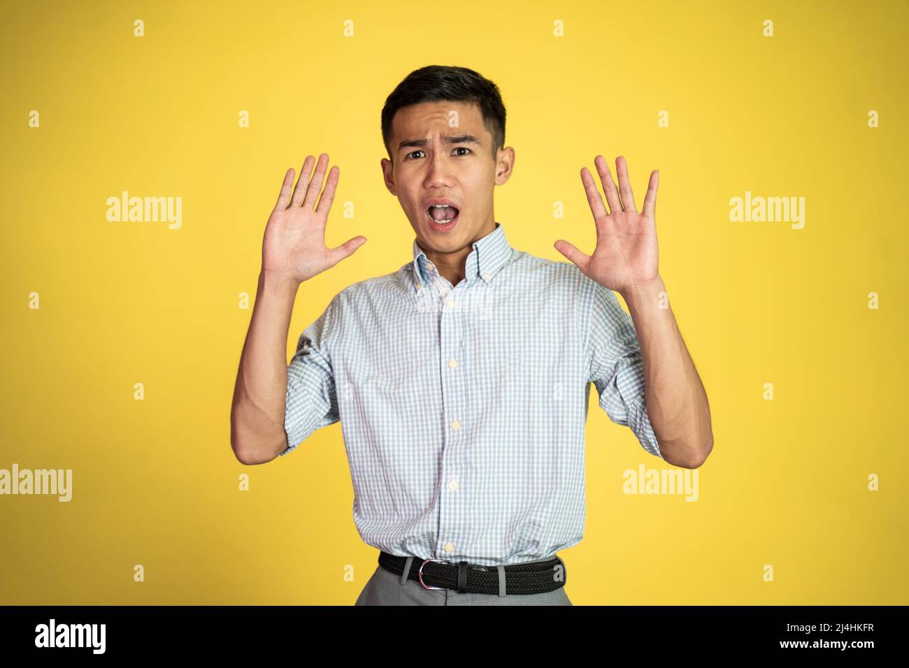 asian young young man with scared gesture on isolated Stock Photo - Alamy
