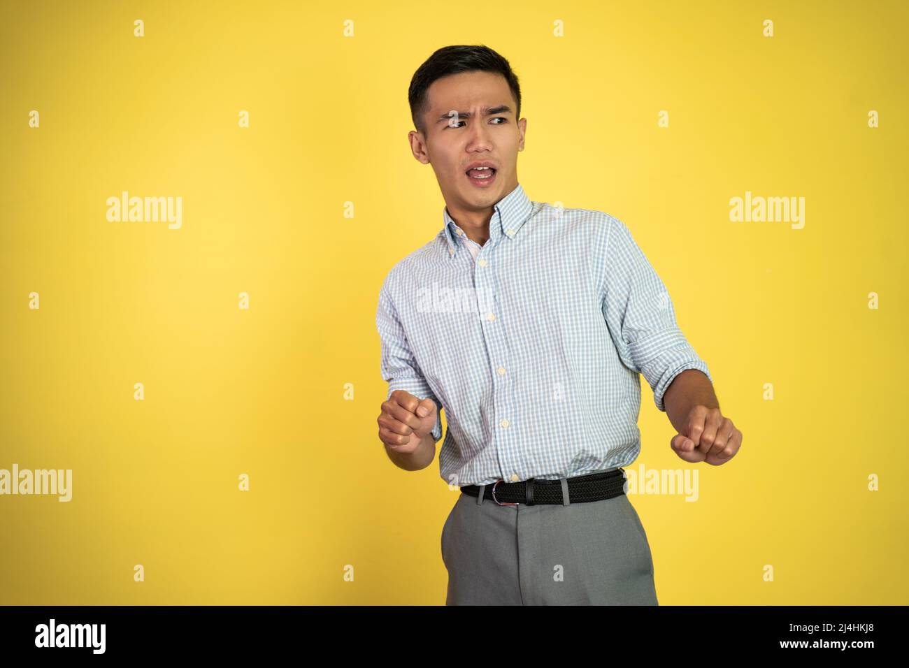 asian man shocked expression standing over isolated background Stock ...