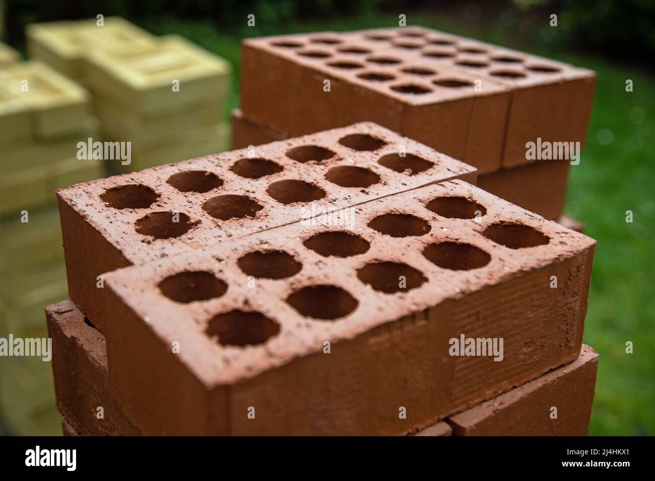 Close up shot of red engineering bricks and yellow toned London bricks ...