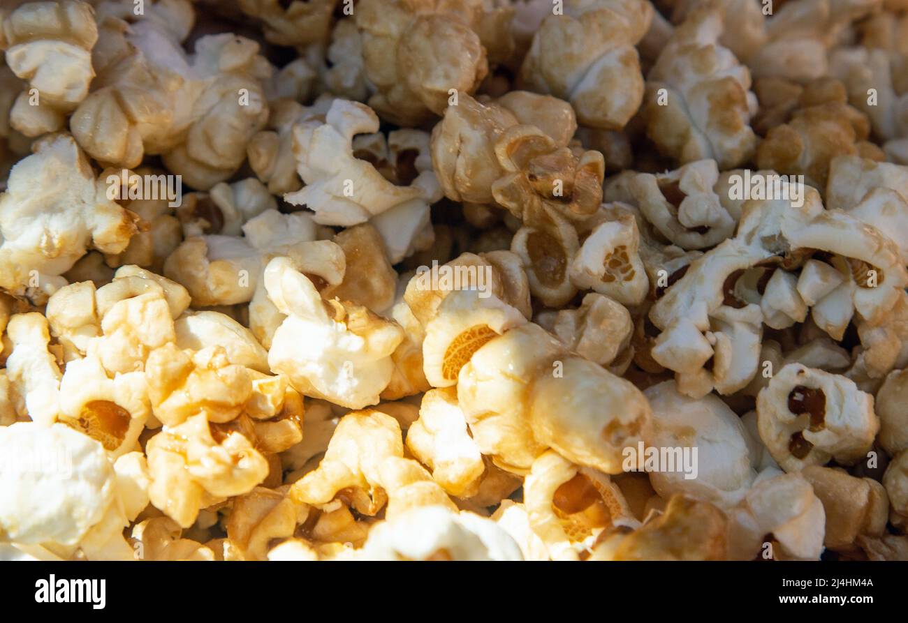 Golden popcorn shot close up for use as a background Stock Photo - Alamy