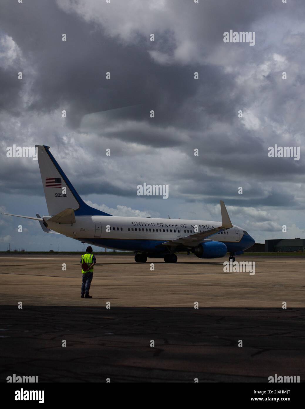 A Royal Australian Air Force (RAAF) airman observes a C-40B VIP ...