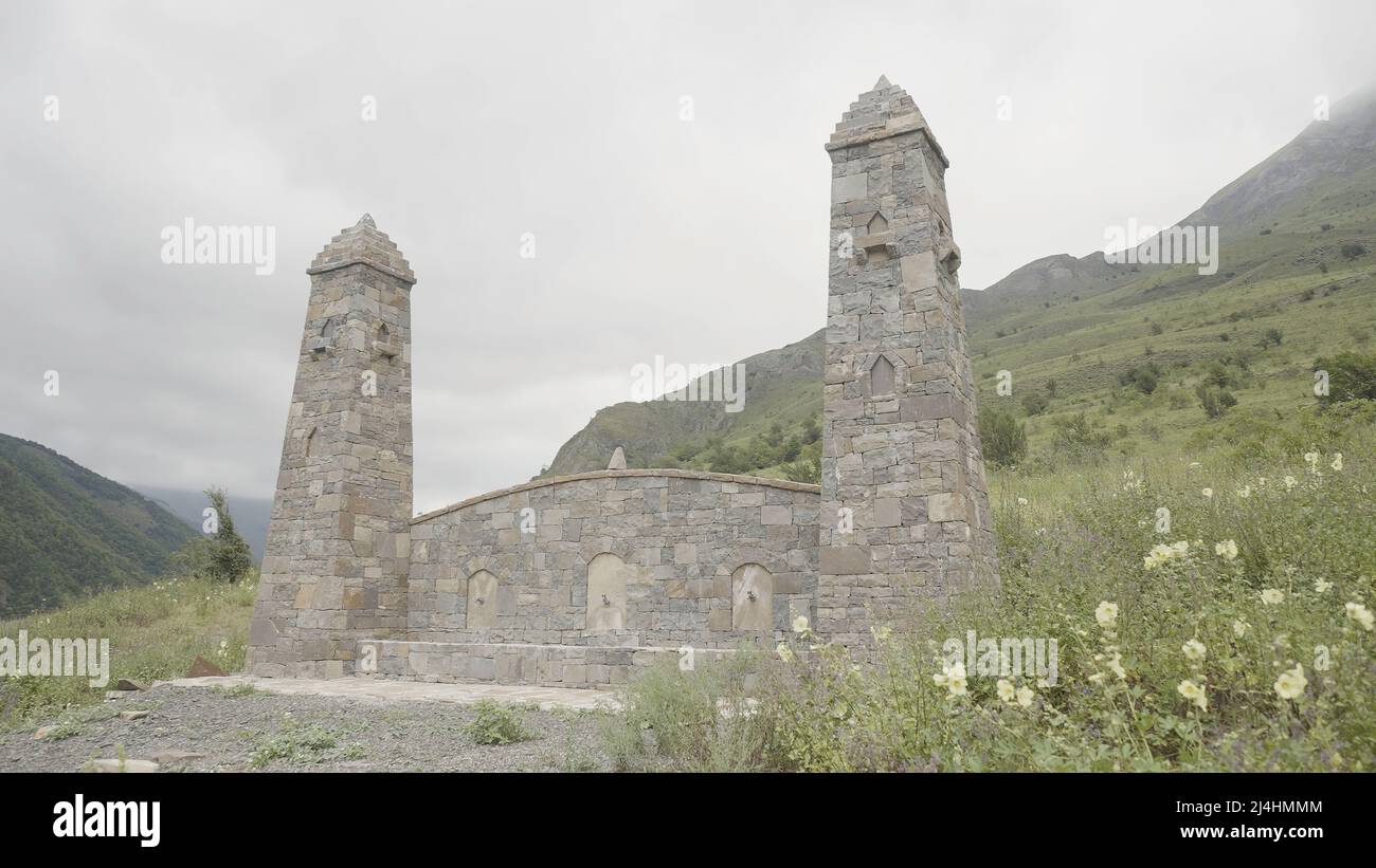 Medieval towers in mountains in summer. Action. Nature reserve with ...