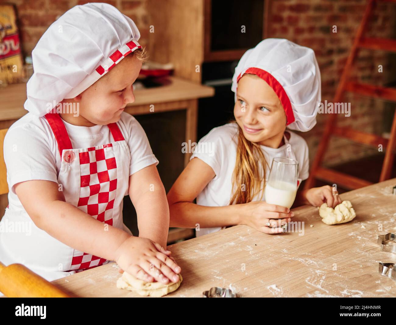 Two kids cooking in a domestic kitchen. Happy family, happy children ...