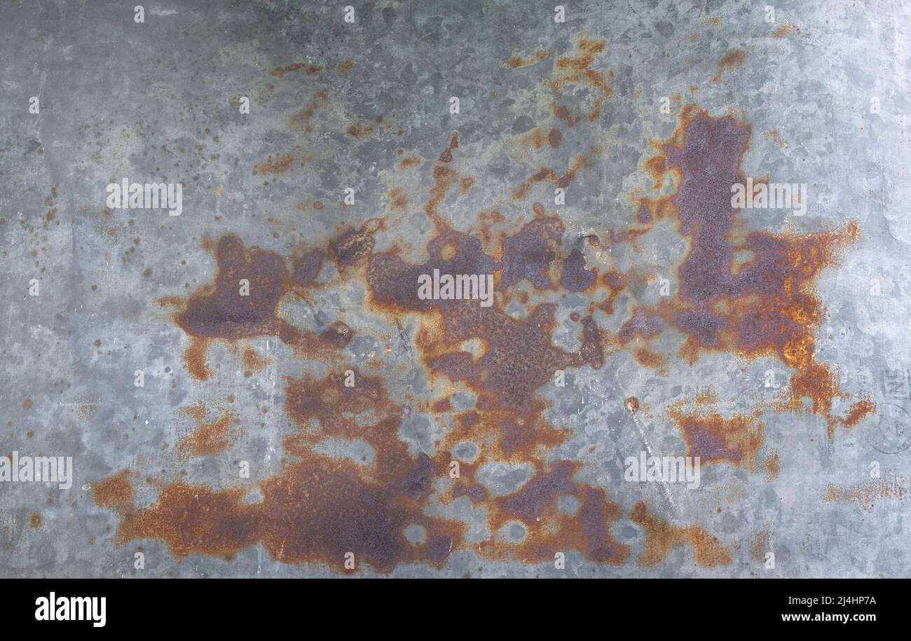 Aged sheet of metal with rusted areas all over Stock Photo - Alamy