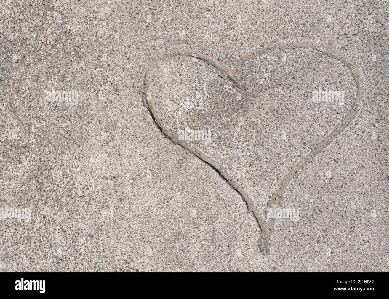 Free formed heart shape in concrete pavement in Bali. Copy space for ...