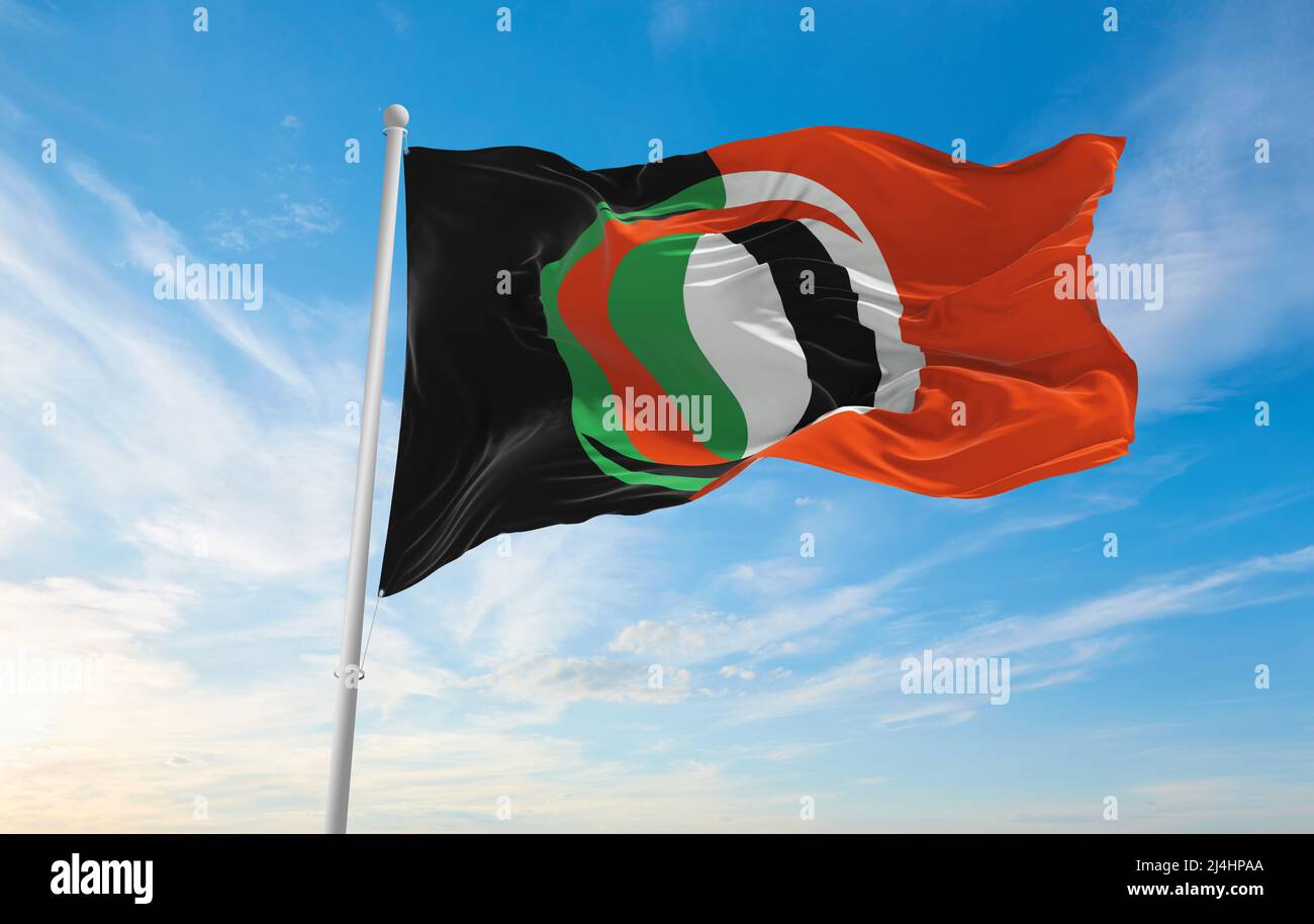 official flag of Arab-European League, Belgium at cloudy sky background ...
