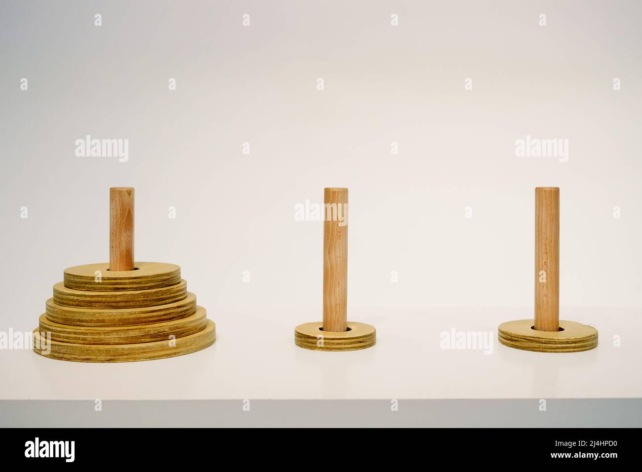Wooden hanoi towers isolated on white background Stock Photo - Alamy