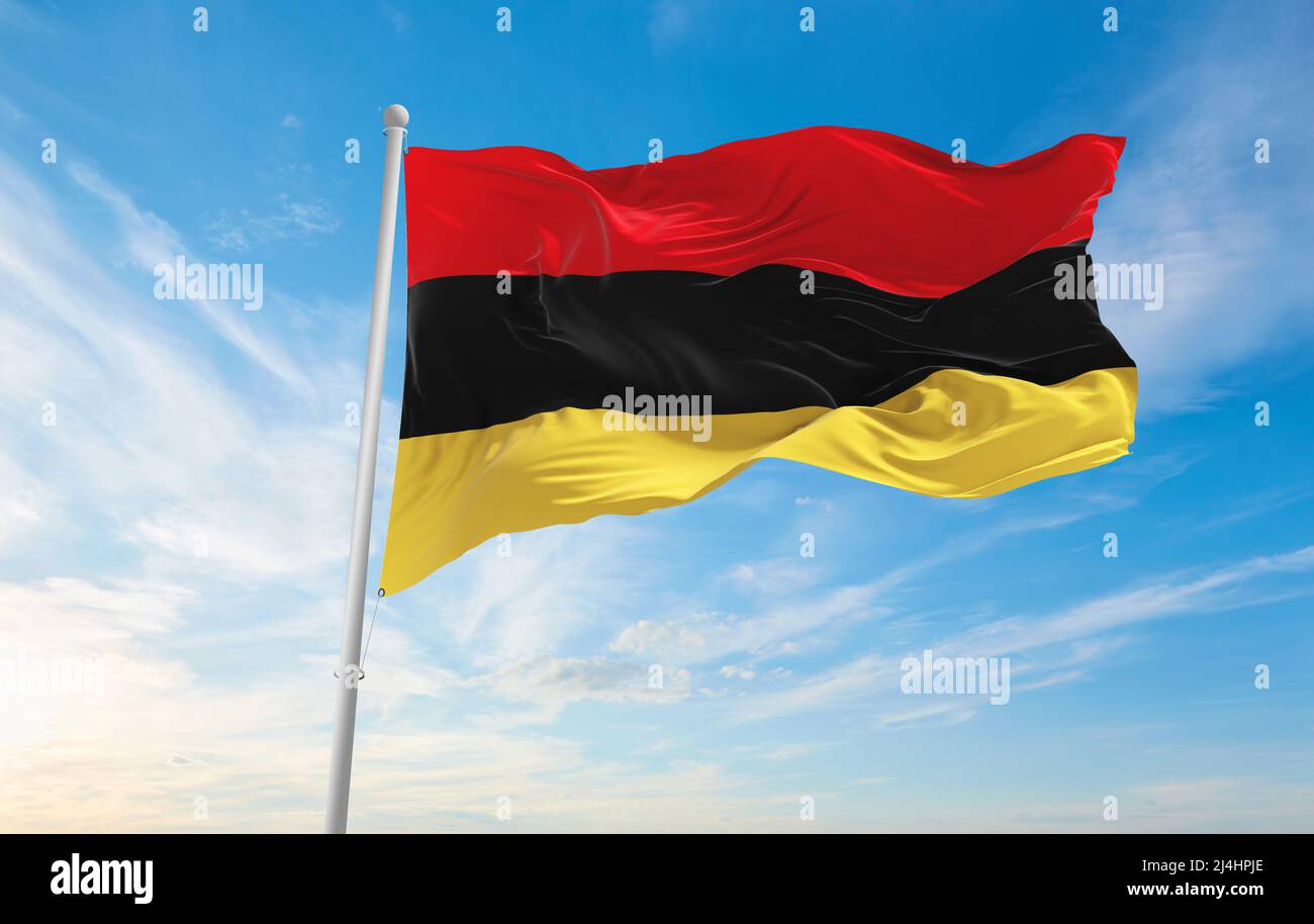 official flag of Brabantine Revolution, Belgium at cloudy sky ...