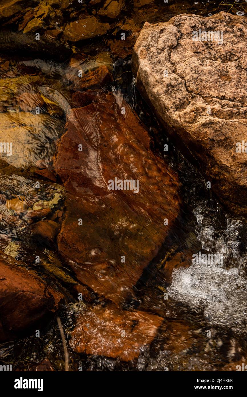 Water Rushing Over Shallow Rocks Below The Surface in creek in Zion ...