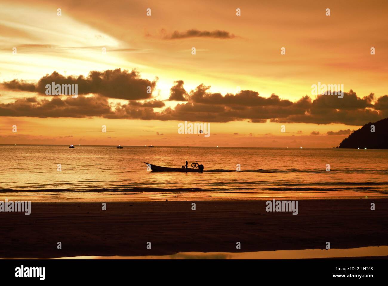View of sunset at Cenang beach in Langkawi Malaysia Stock Photo - Alamy