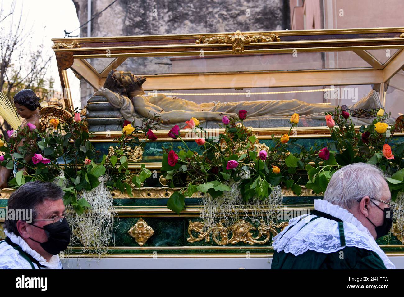 Two bearers carry the image of Jesus Christ in his coffin during the ...