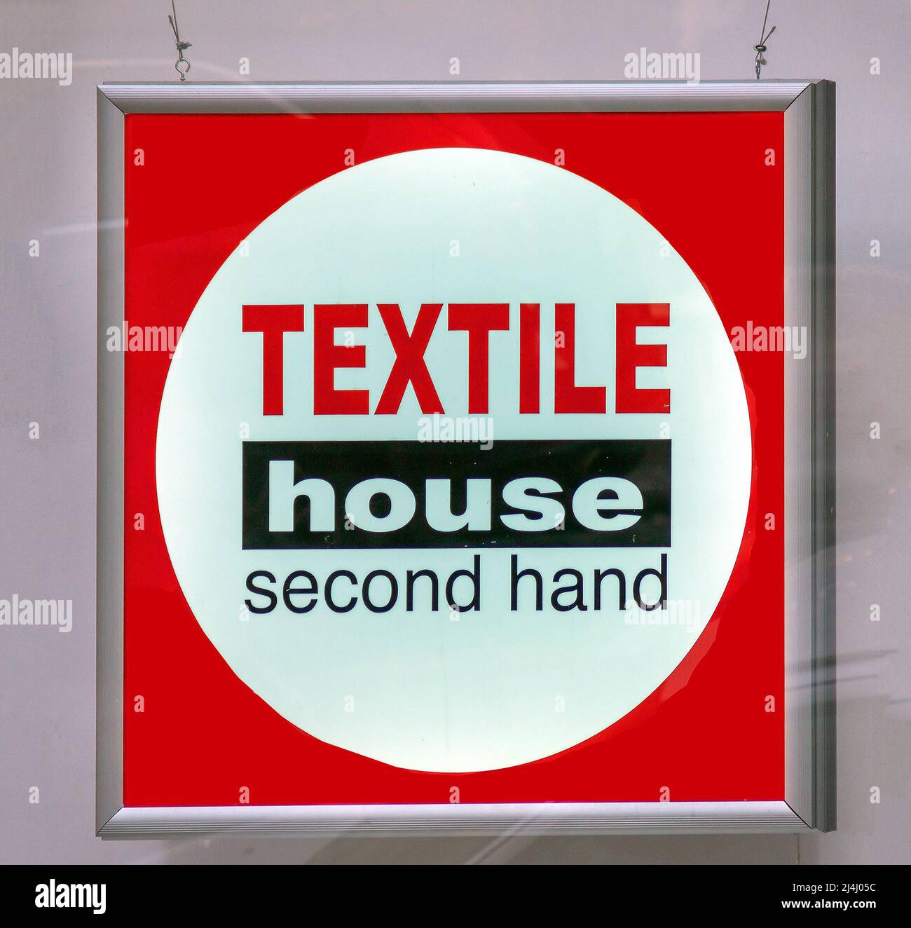Outdoors sign for second hand textile house Stock Photo - Alamy