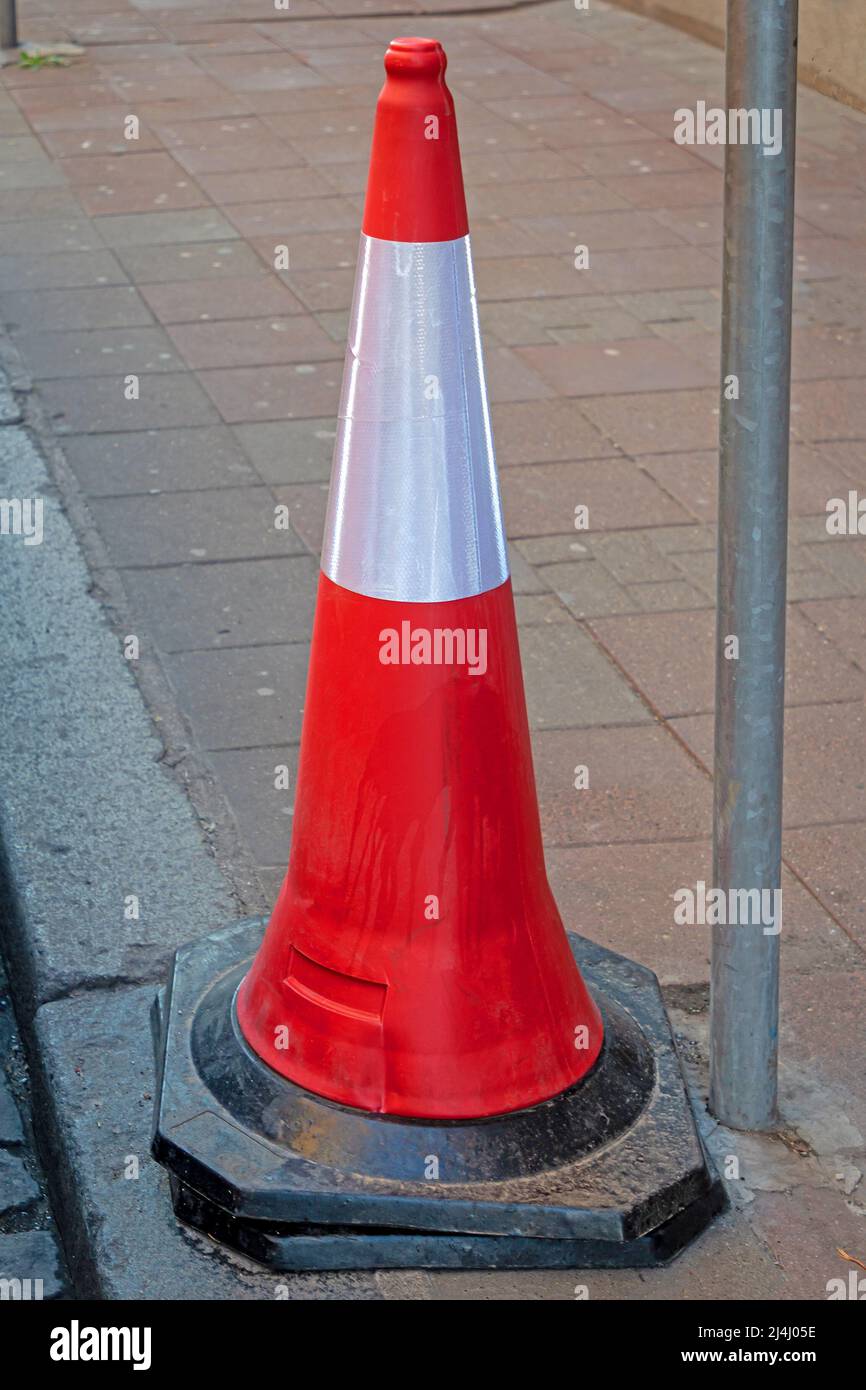 Orange traffic pole outside on street sidewalk Stock Photo - Alamy