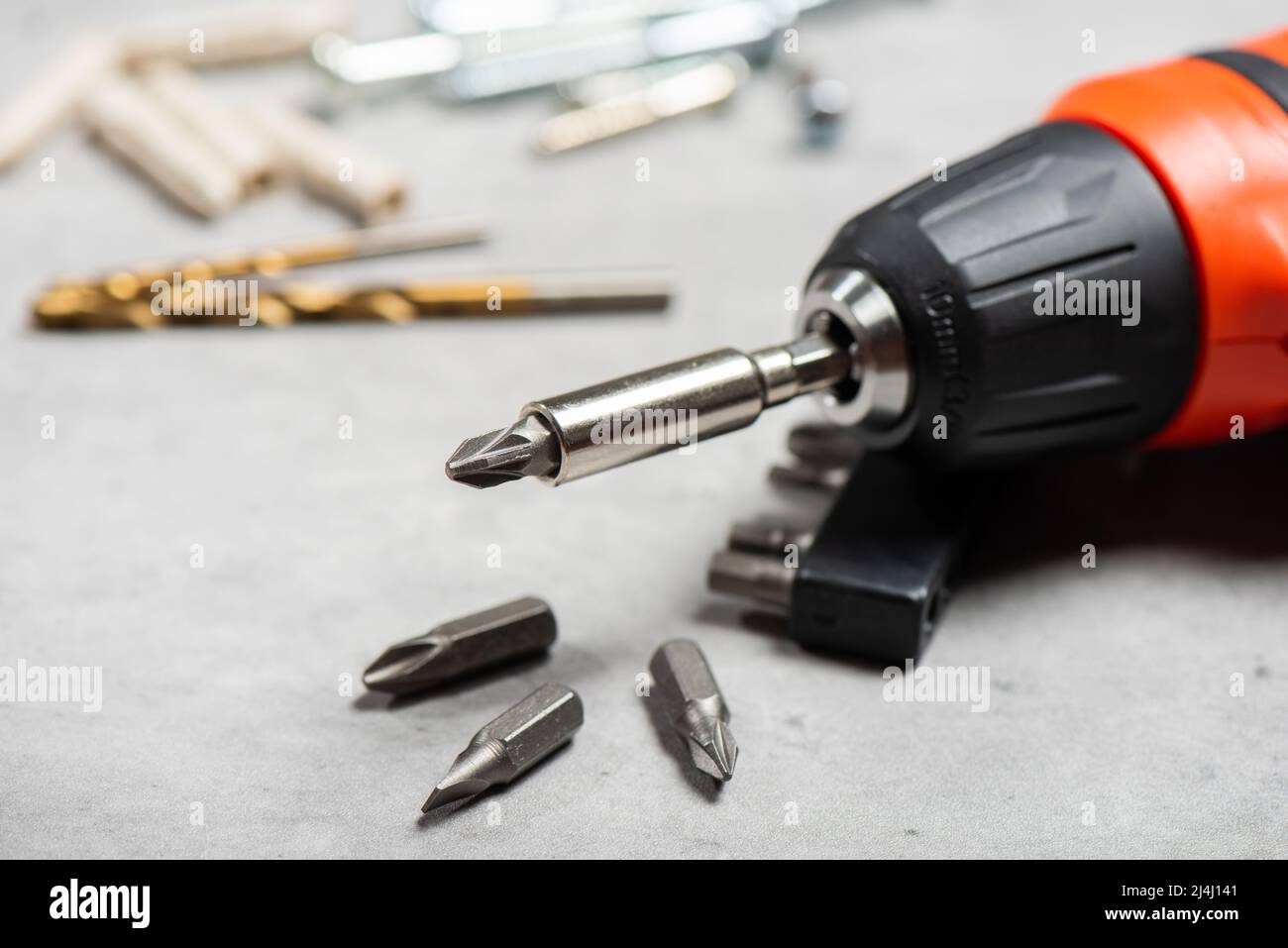 Black-orange cordless screwdriver drill. Power tool for construction ...