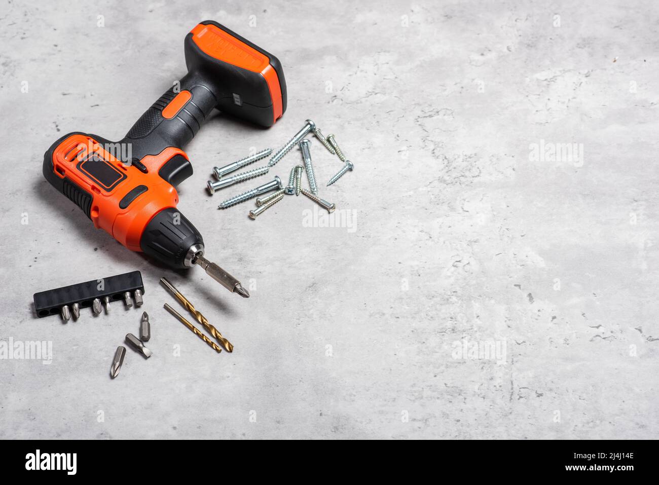 Black-orange cordless screwdriver drill. Power tool for construction ...