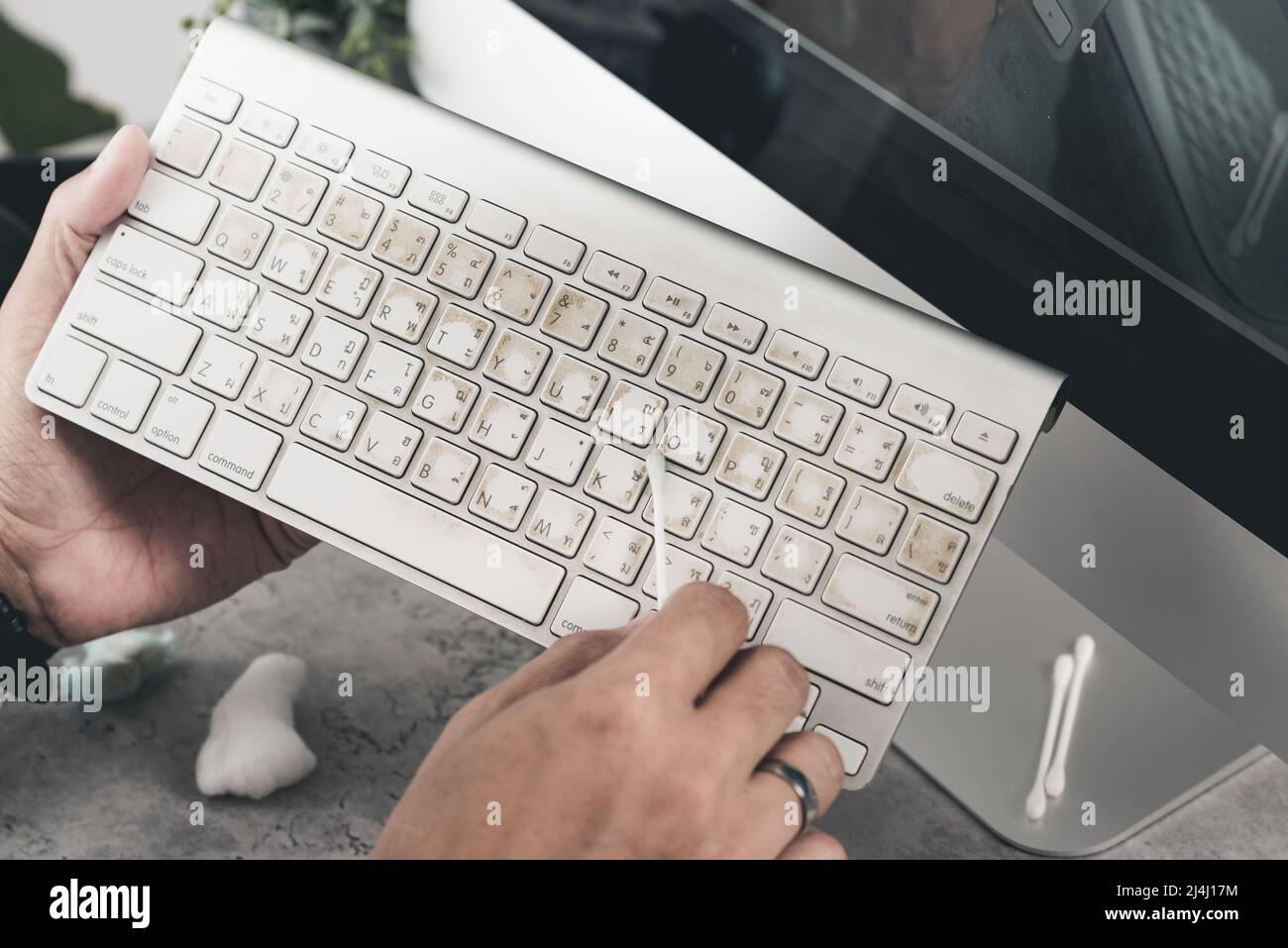 The man cleaning his computer keyboard. Grimy, more bacteria on ...