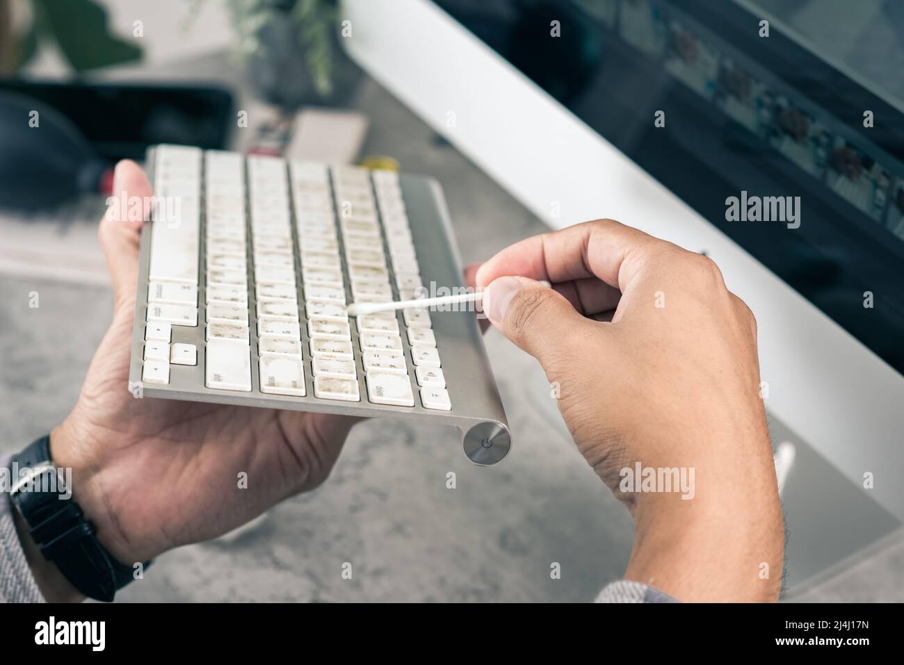 The man cleaning his computer keyboard. Grimy, more bacteria on ...
