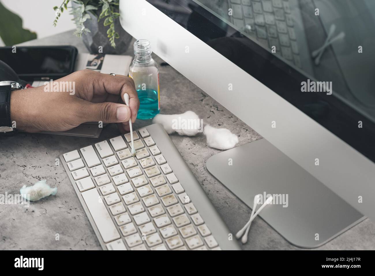 The man cleaning his computer keyboard. Grimy, more bacteria on ...