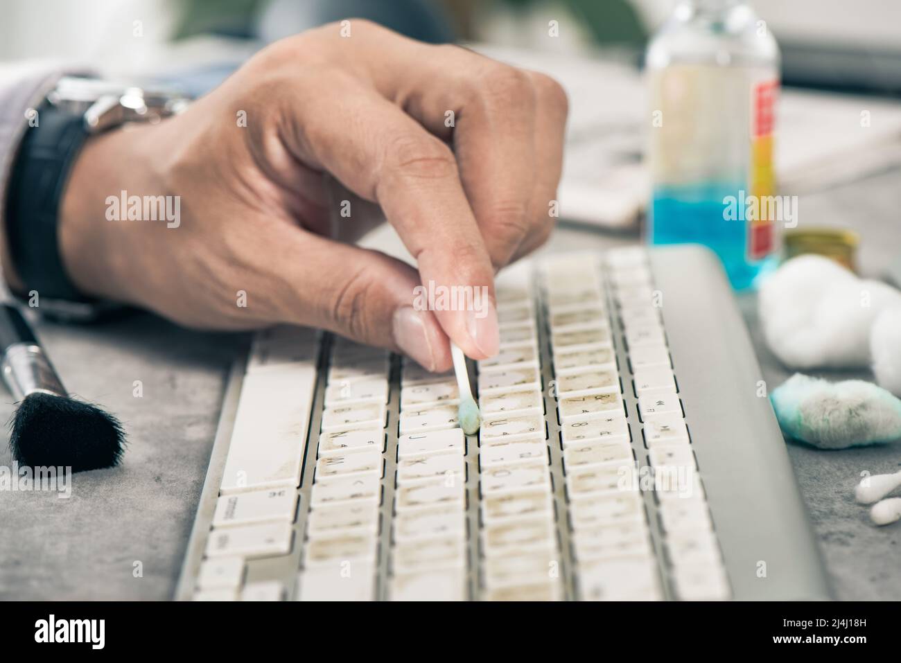 The man cleaning his computer keyboard. Grimy, more bacteria on ...
