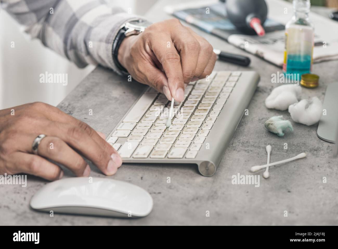 The man cleaning his computer keyboard. Grimy, more bacteria on ...