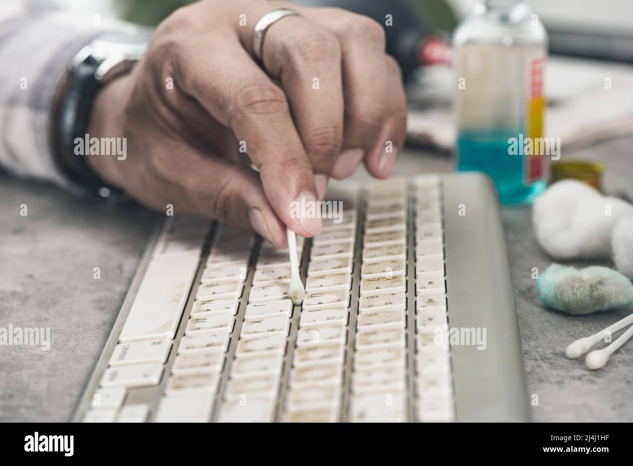 The man cleaning his computer keyboard. Grimy, more bacteria on ...