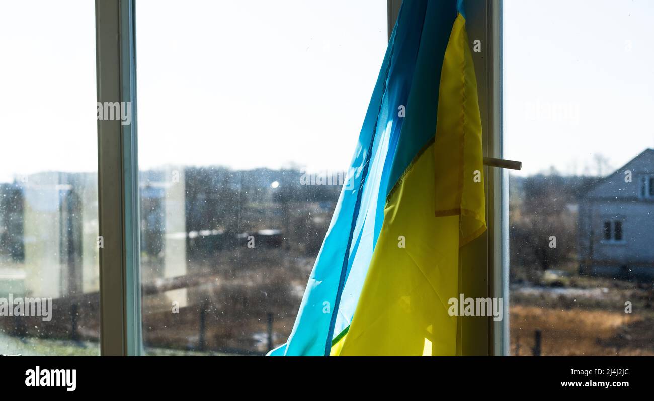 Support Ukraine. Ukrainian flag on the window. Place for text Stock ...