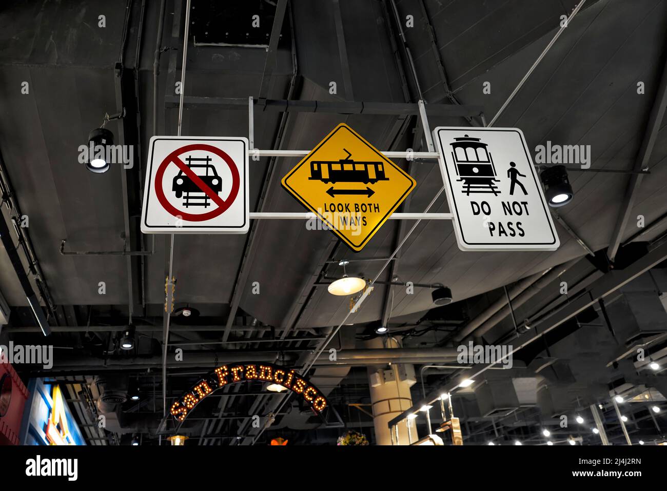 Overhead signs warning of train passing beneath Stock Photo - Alamy