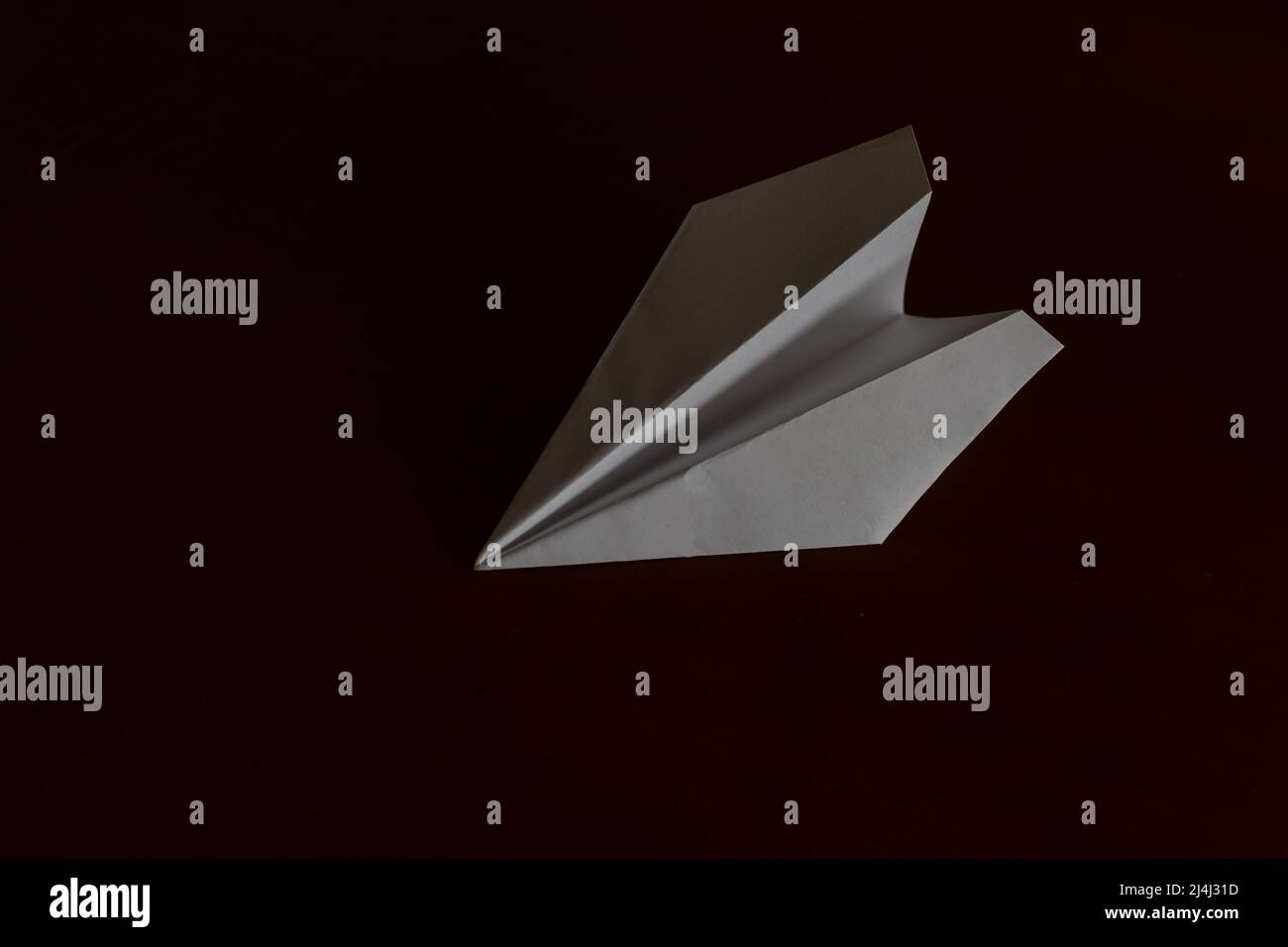 paper airplane on an old wooden table Stock Photo - Alamy