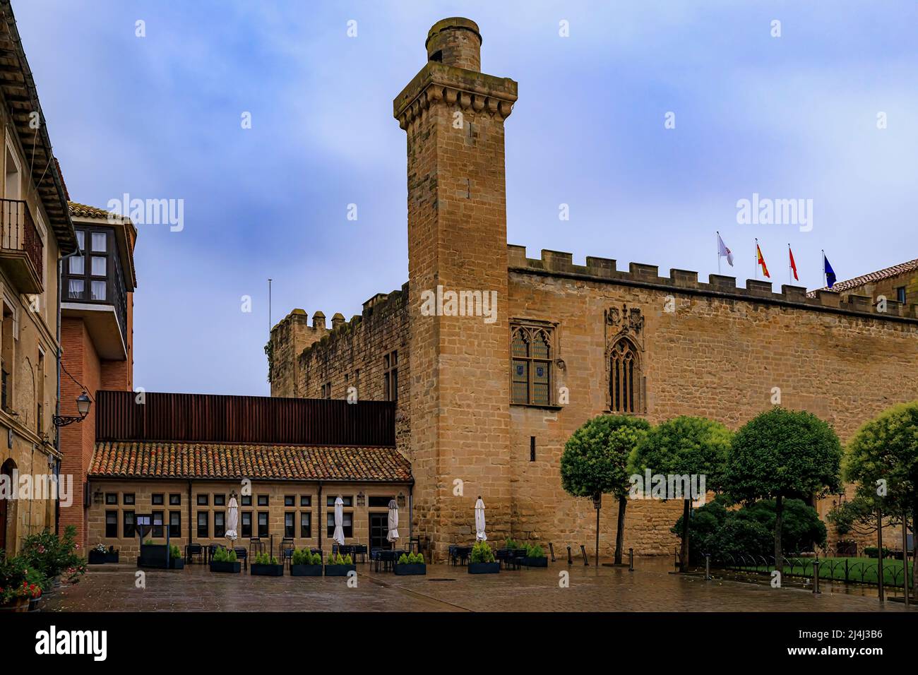 Medieval stone walls surrounding a park on Plaza de los Teobaldos Town ...