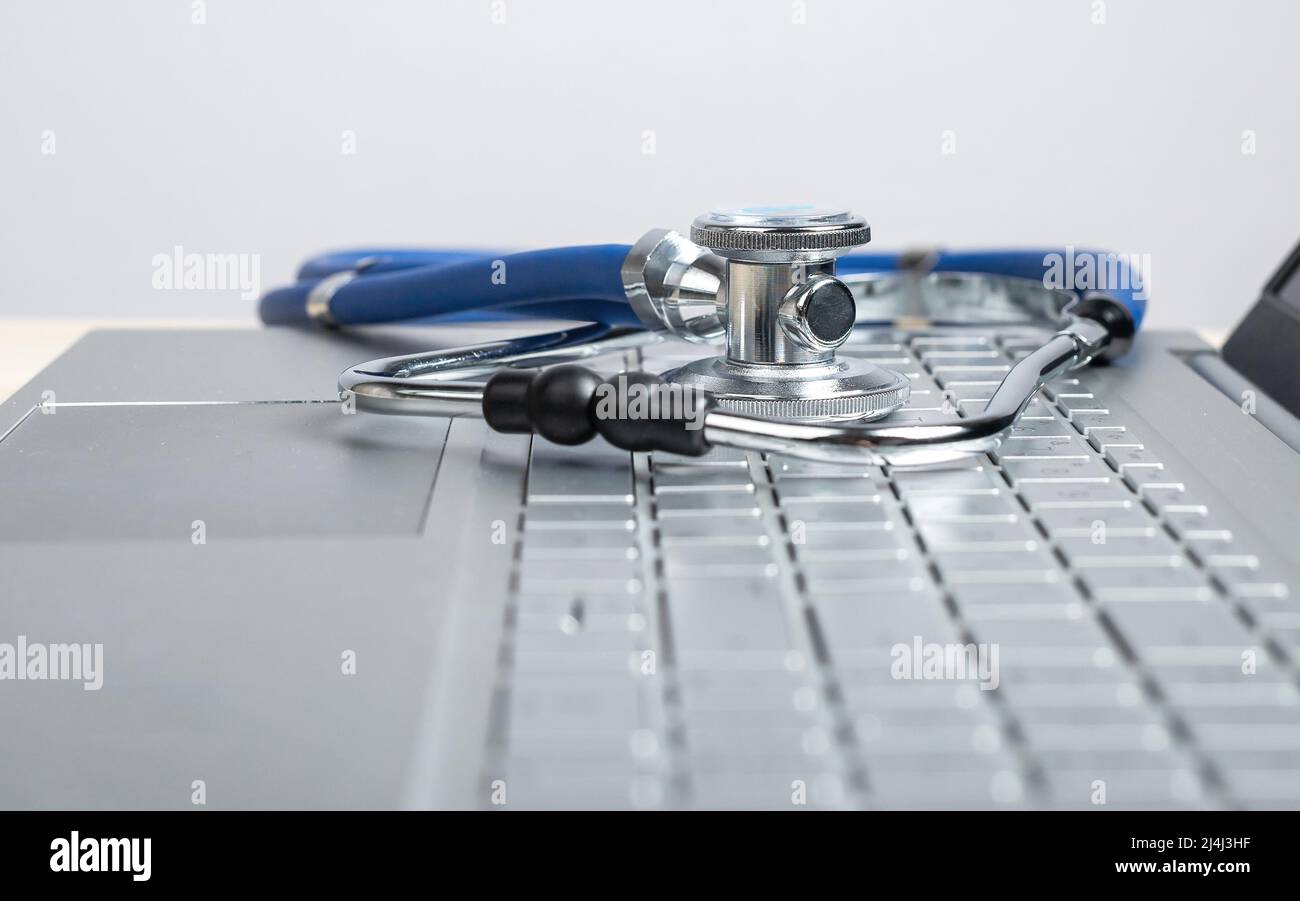 Stethoscope on laptop. Telemedicine, telehealth concept. Online video ...